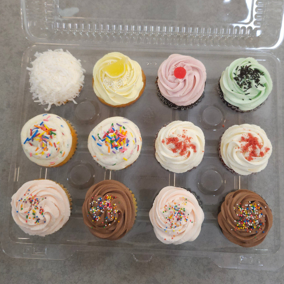 12 Assorted Cupcakes in a tray– Butter Baked Goods